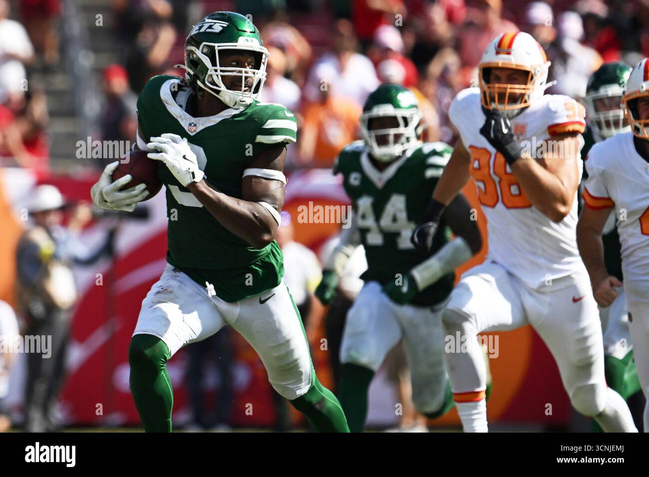 New York Jets defensive end Will McDonald IV (9) runs for a touchdown ...