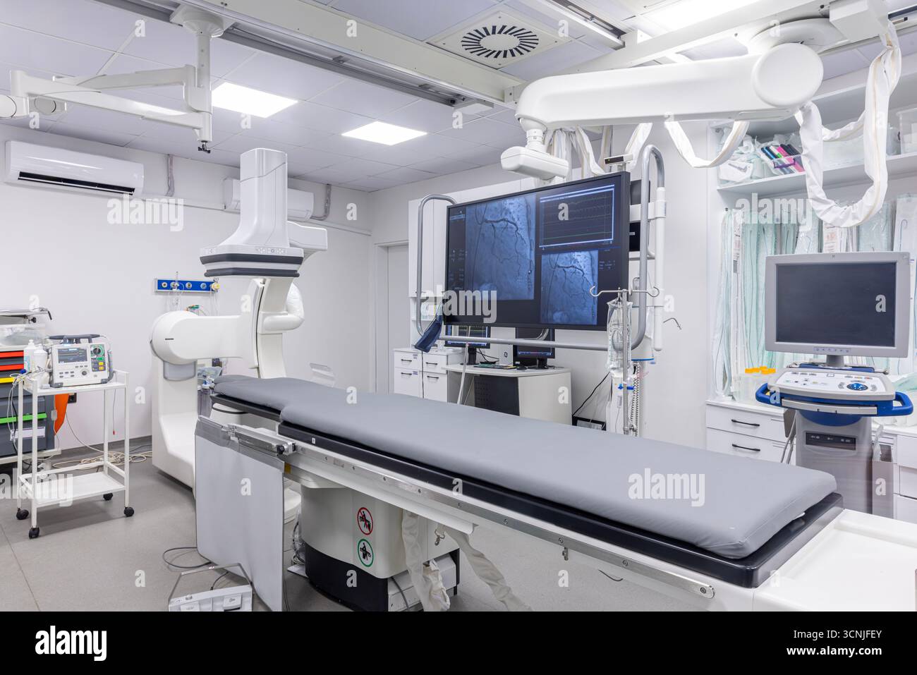 A hospital room with a monitor displaying a patient's heart rate ...