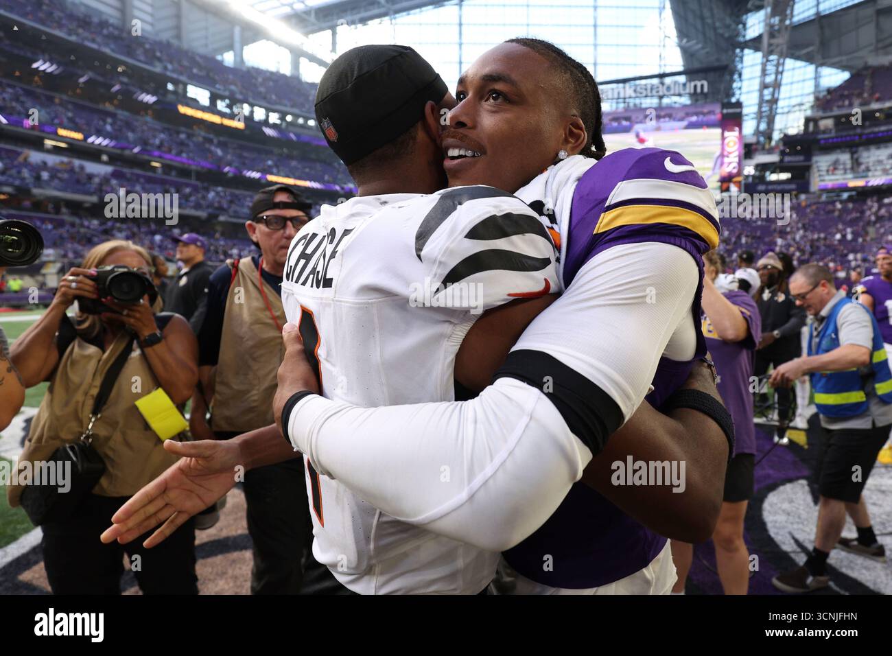 Minnesota Vikings wide receiver Justin Jefferson, right, hugs ...