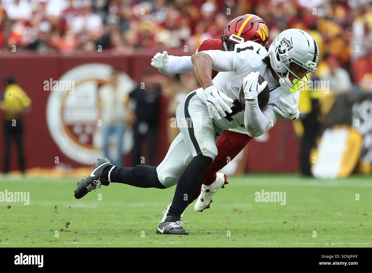 Las Vegas Raiders wide receiver Tre Tucker (1) runs with the ball ...
