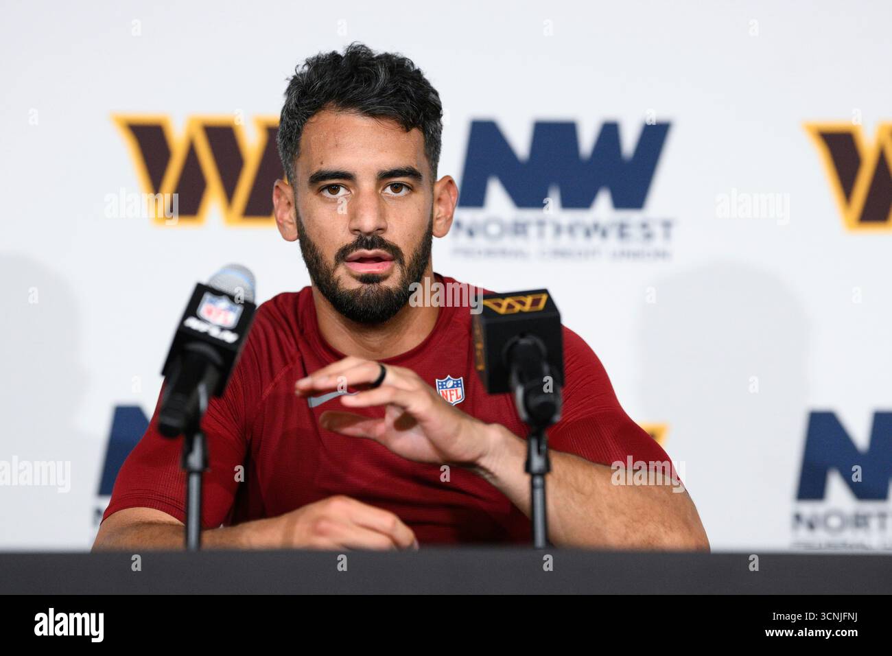 Washington Commanders quarterback Marcus Mariota speaks during a news ...