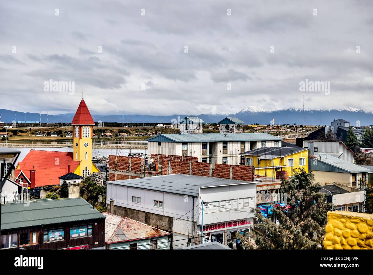 A colorful view of a central street in downtown Ushuaia, featuring ...