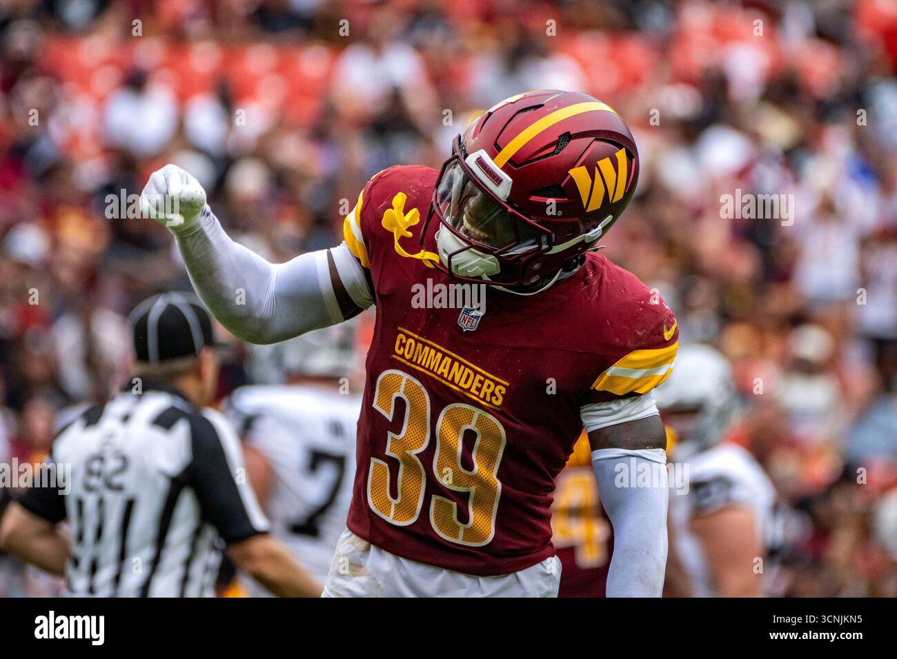 Washington Commanders safety Jeremy Reaves (39) reacts after stopping a ...