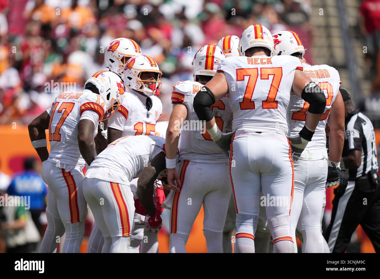The Tampa Bay Buccaneers offense huddles during an NFL football game ...