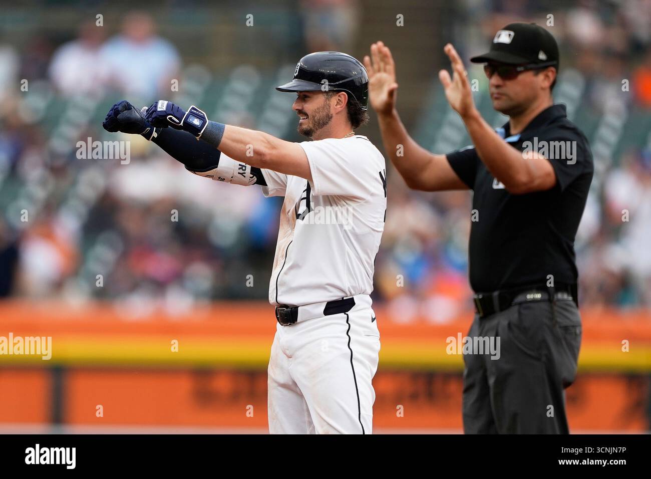 Detroit Tigers' Zach McKinstry, left, celebrates after hitting a double ...