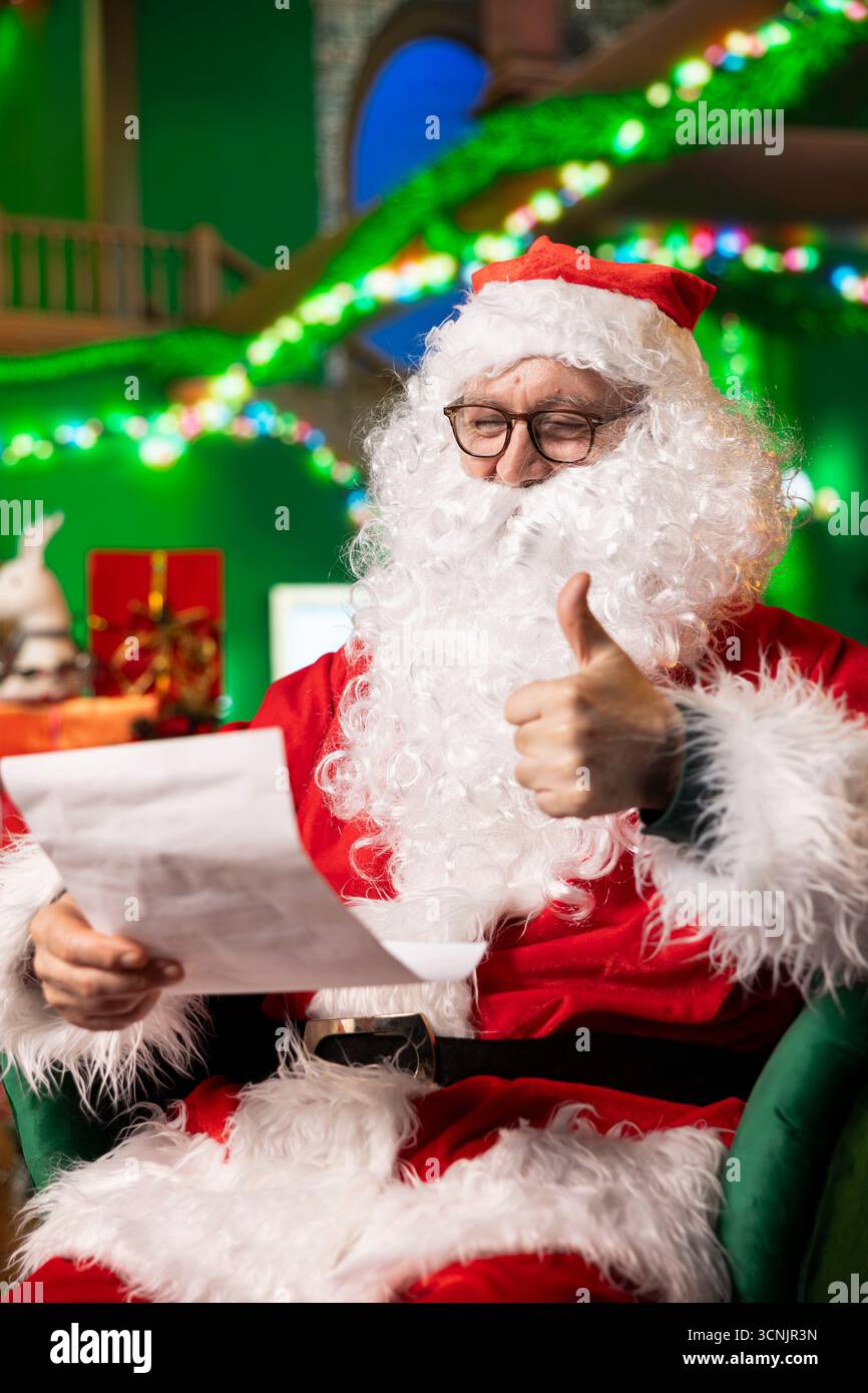 Santa claus opening reading old hi-res stock photography and images - Alamy