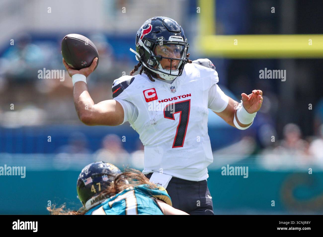 Houston Texans quarterback C.J. Stroud (7) throws the ball under ...