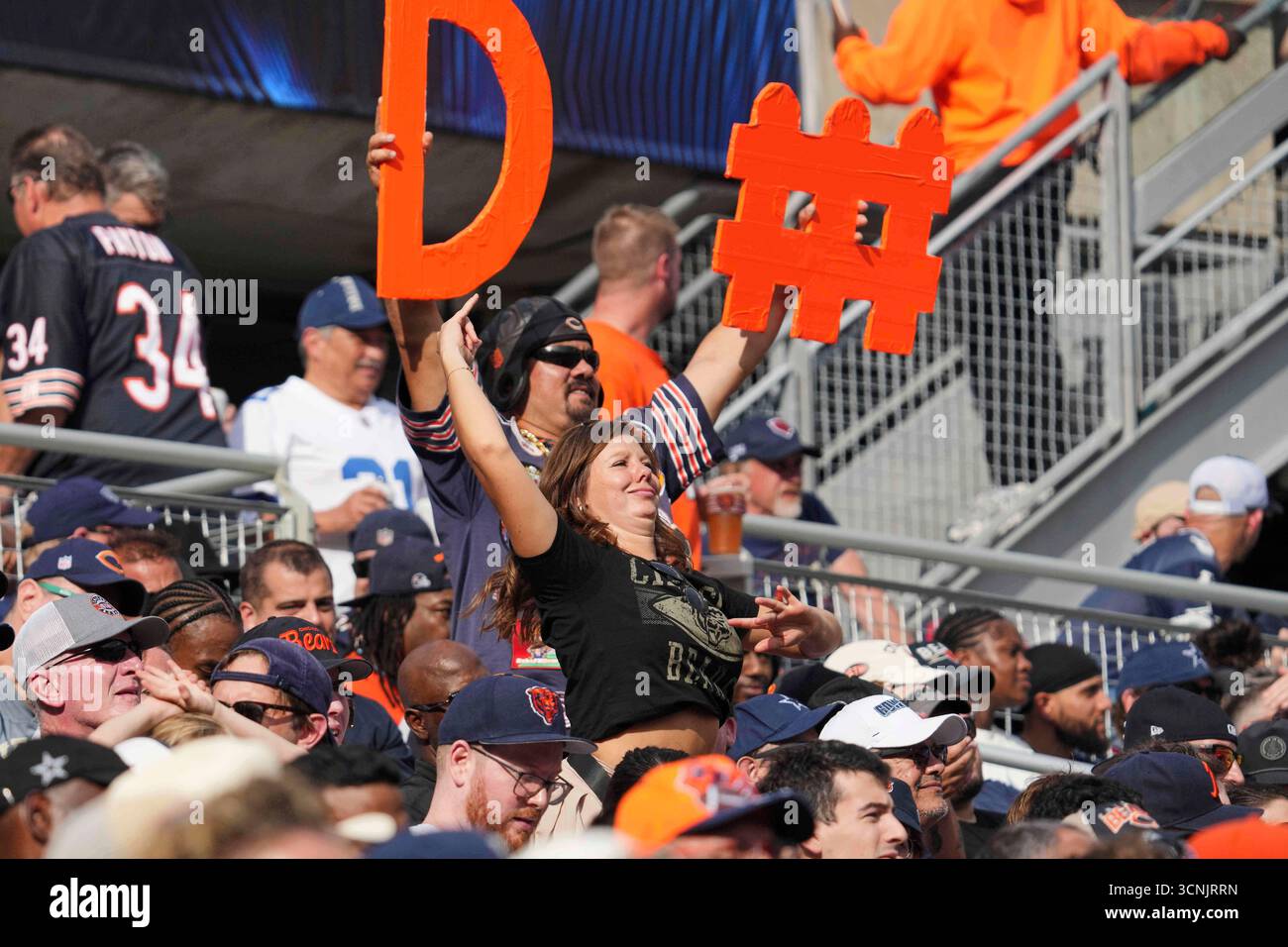 Chicago Bears fans cheer their team in the first half of an NFL ...