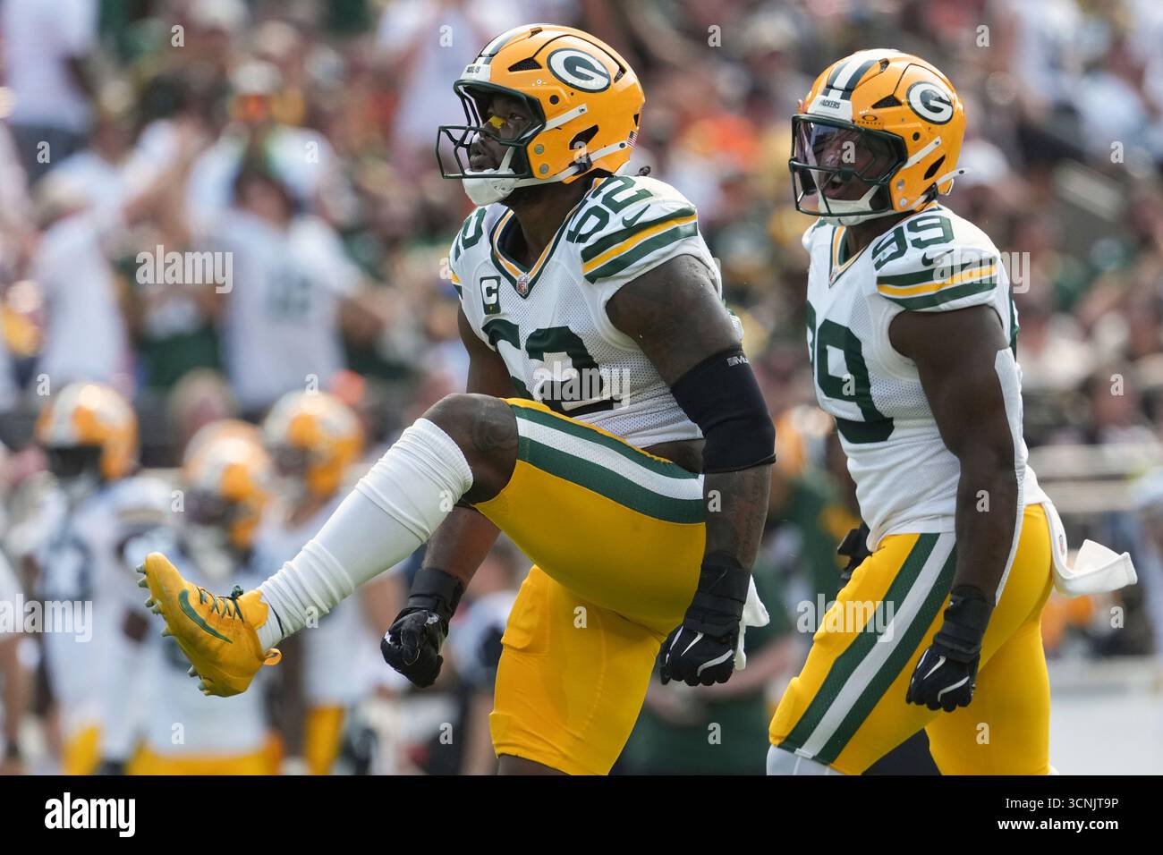 Green Bay Packers defensive end Rashan Gary (52), left, celebrates a ...