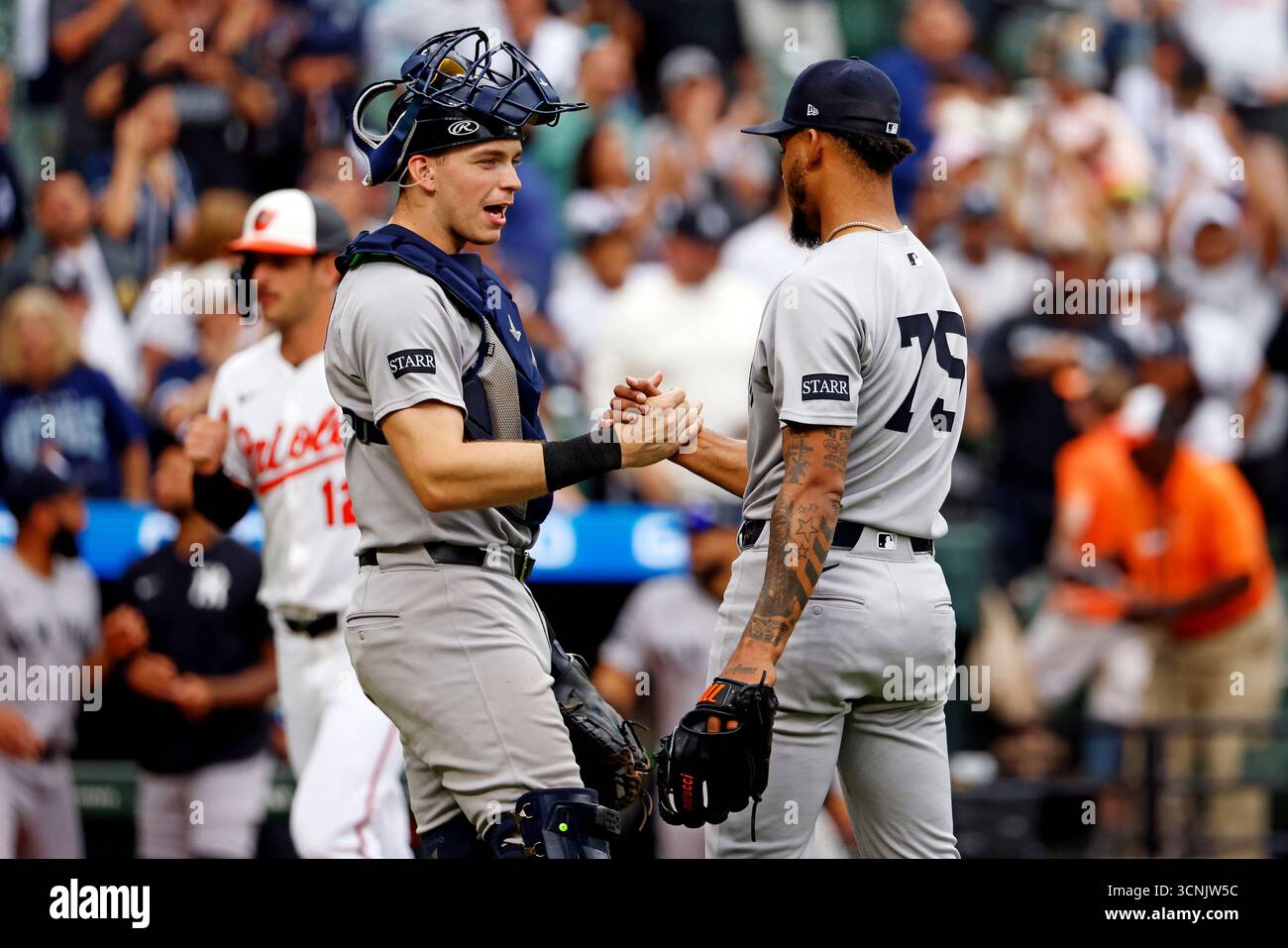 New York Yankees catcher Ben Rice, front left, celebrates with relief ...