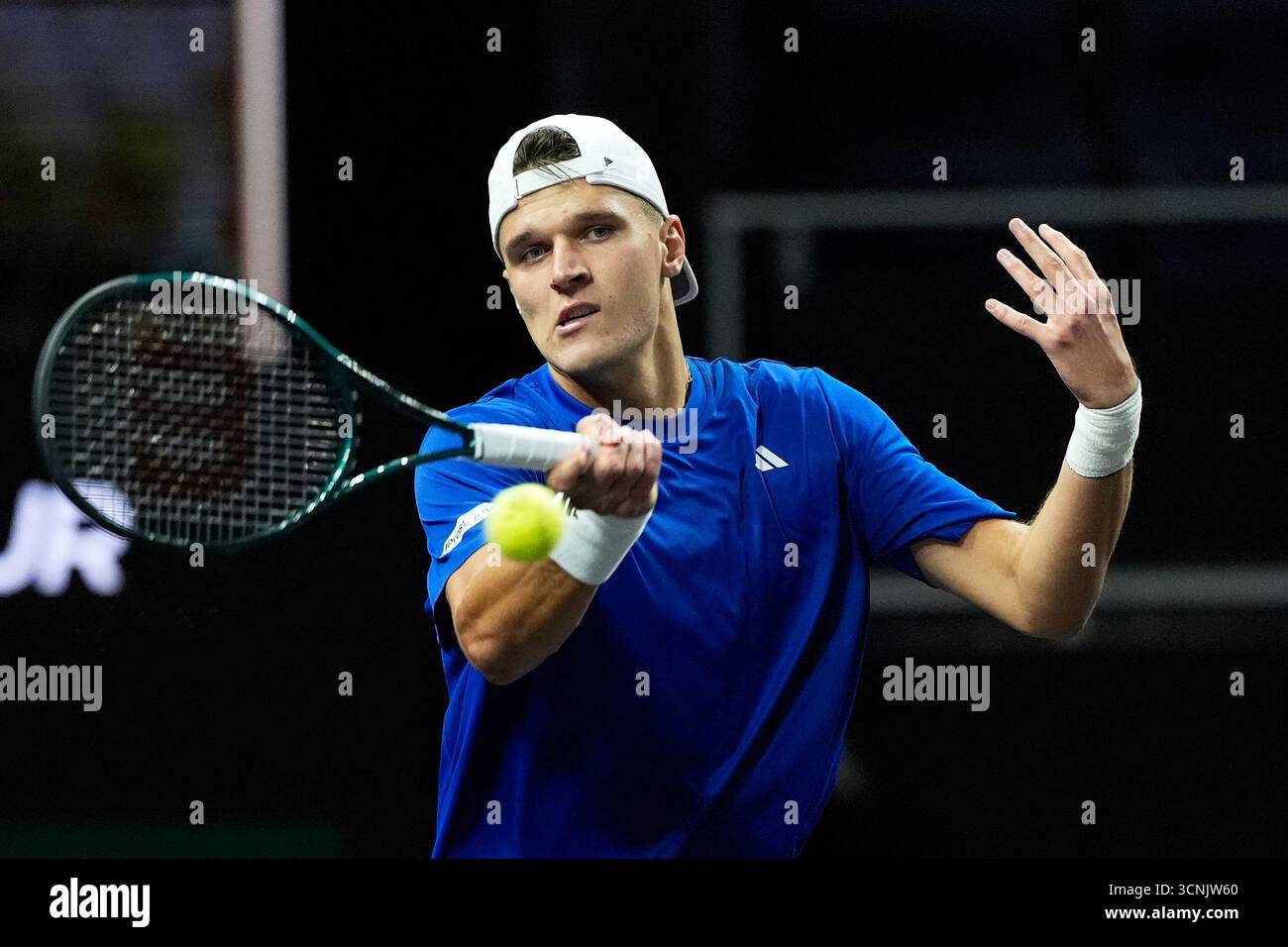Team Europe's Jakub Mensik, of the Czech Republic, returns a shot ...