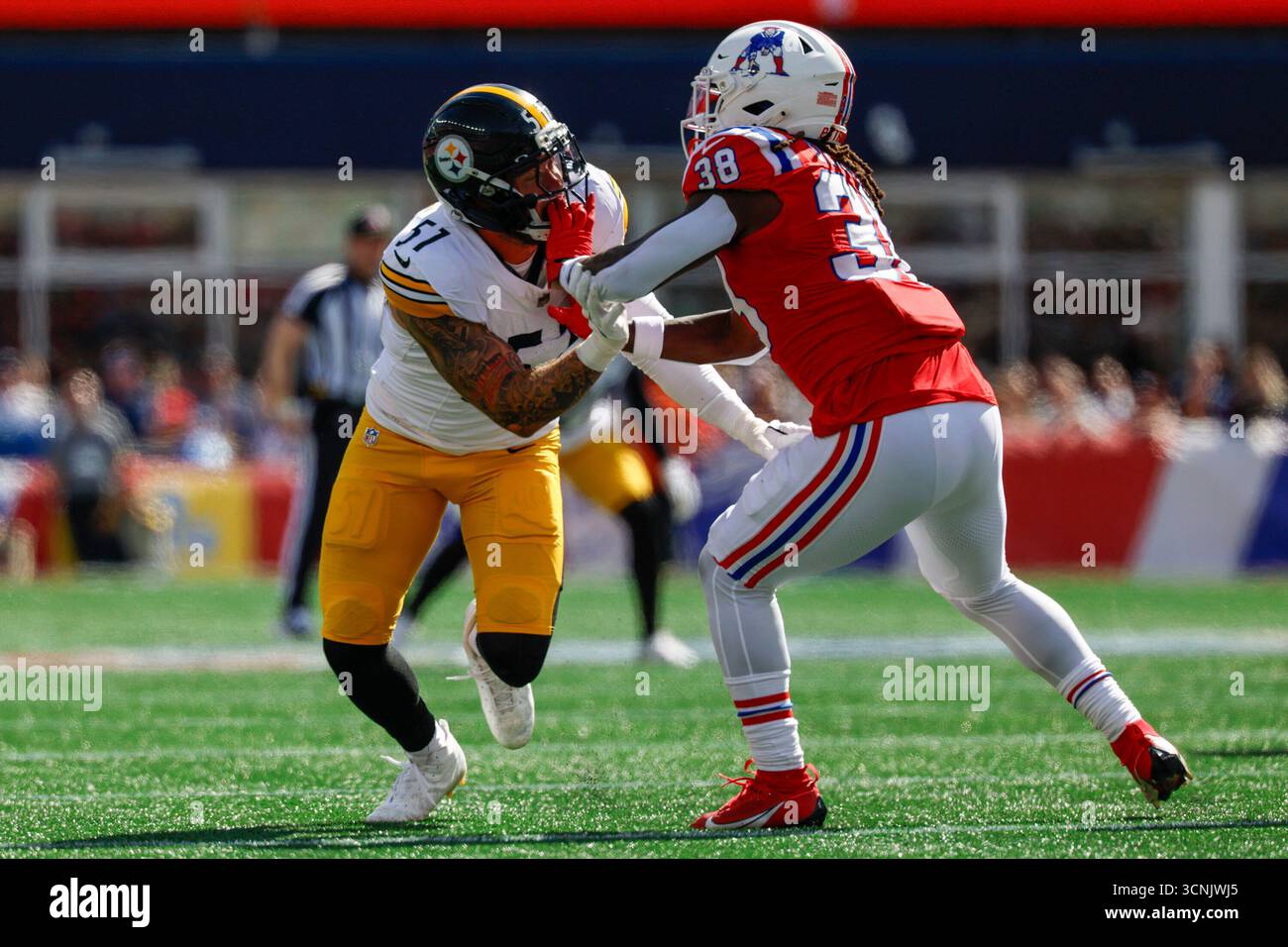 Pittsburgh Steelers linebacker Nick Herbig (51) battles with New England Patriots running back ...