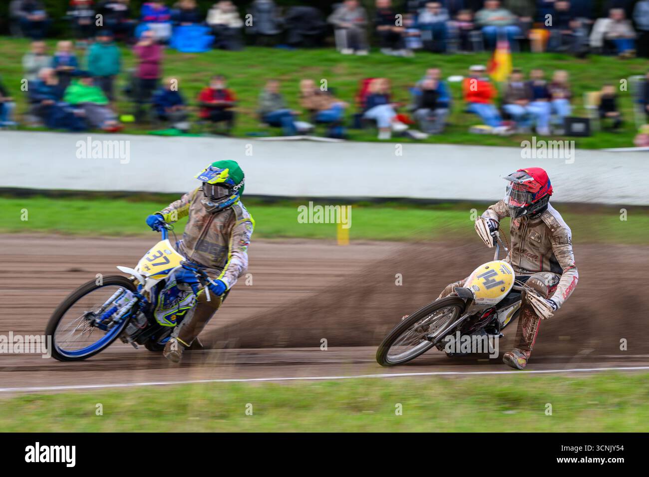 Chris Harris (37) of Great Britain in Green leading Andrew Appleton ...