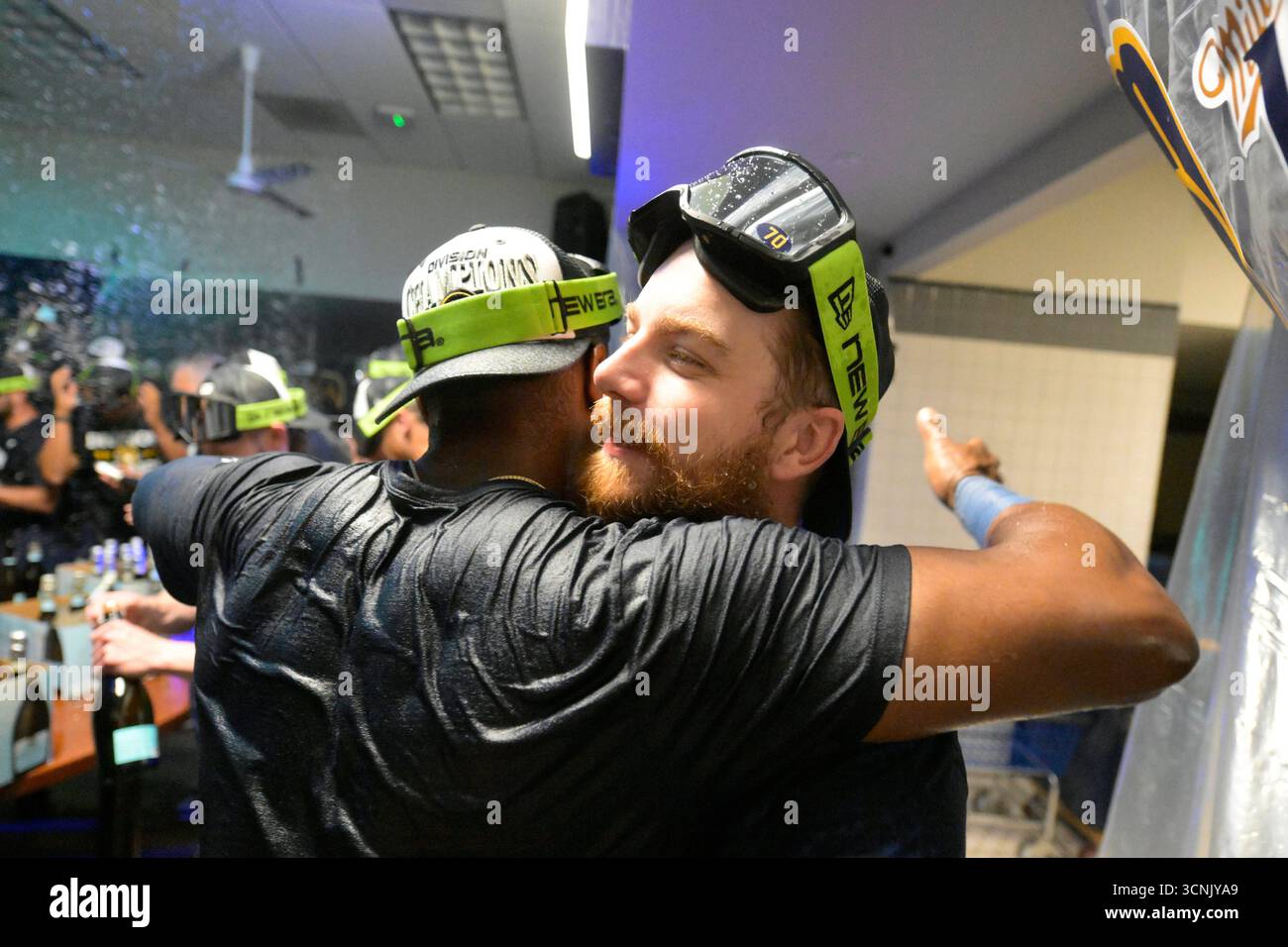 Milwaukee Brewers hitting coach Connor Dawson (70) celebrates with ...