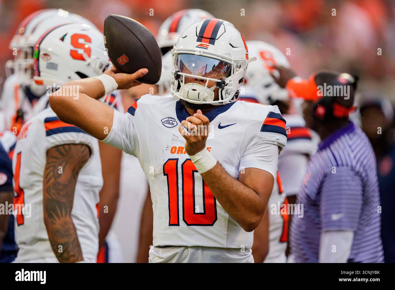 Syracuse quarterback Rickie Collins (10) warms up in the second half of ...