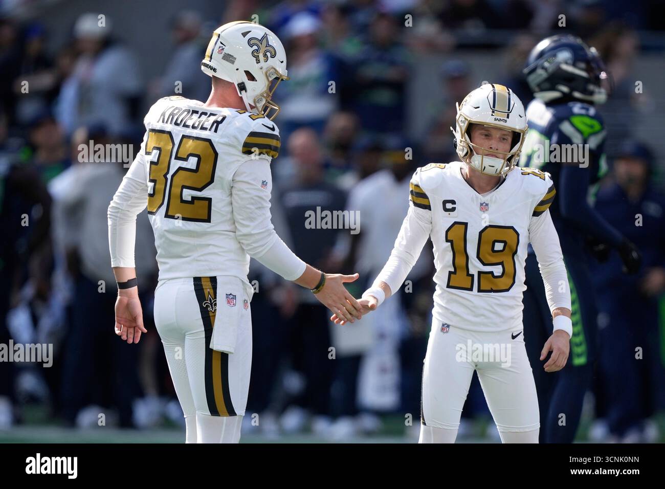 New Orleans Saints place-kicker Blake Grupe (19) is congratulated by ...