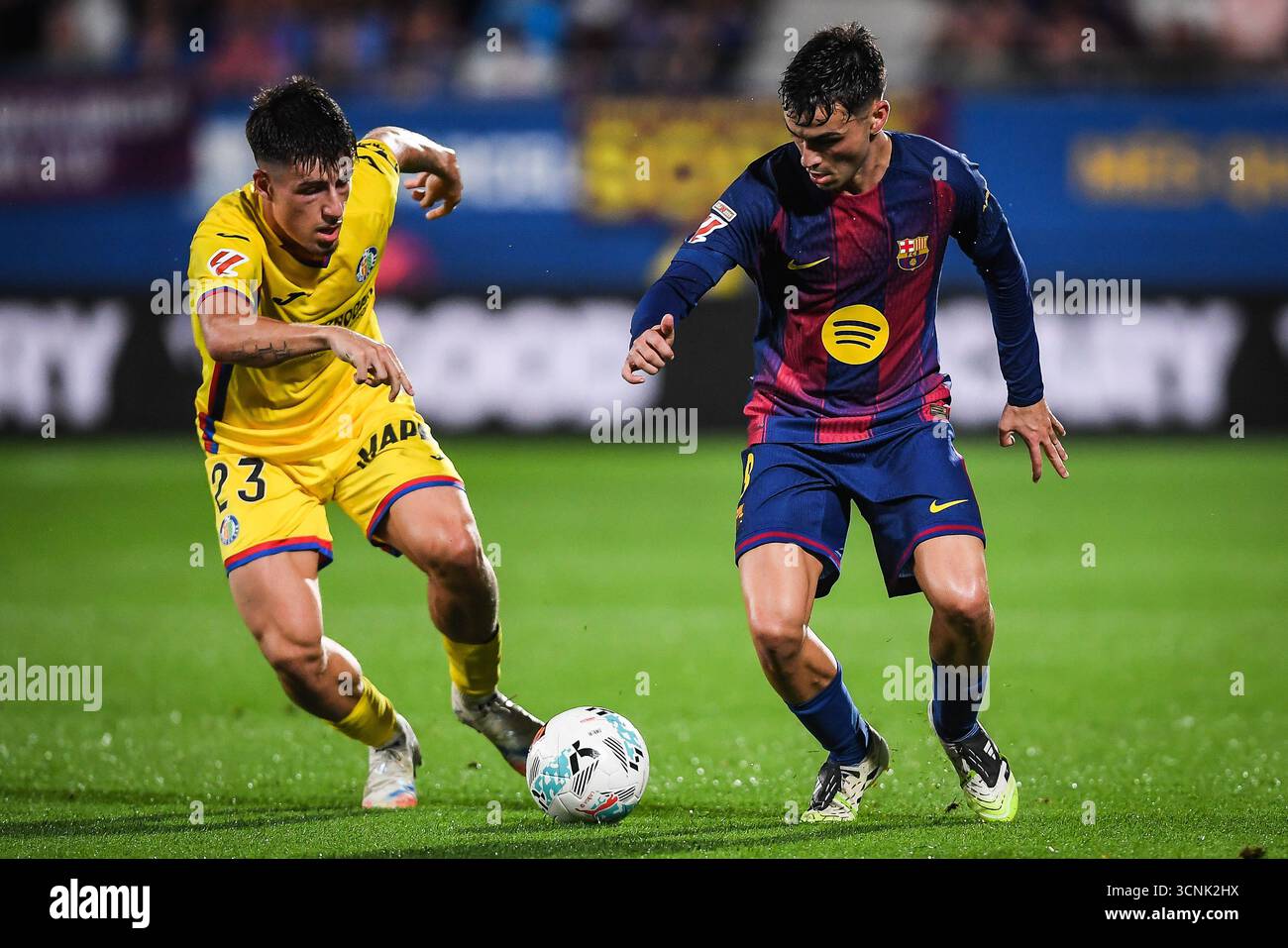 Adrian LISO of Getafe CF and Pedro GONZALEZ LOPEZ (Pedri) of Barcelona ...