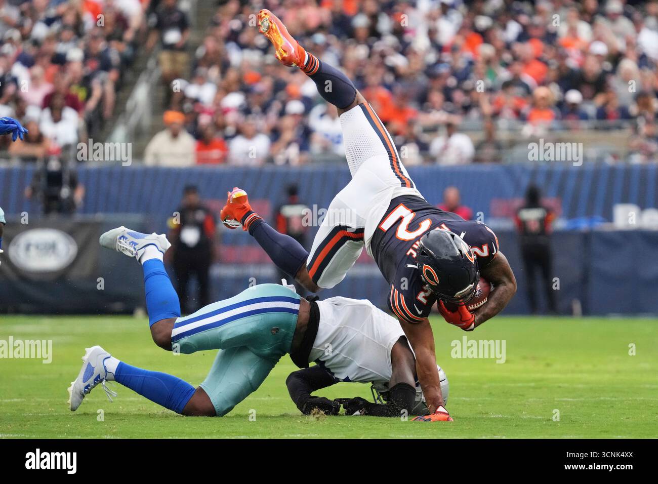 Chicago Bears wide receiver DJ Moore (2) is upended after making a ...