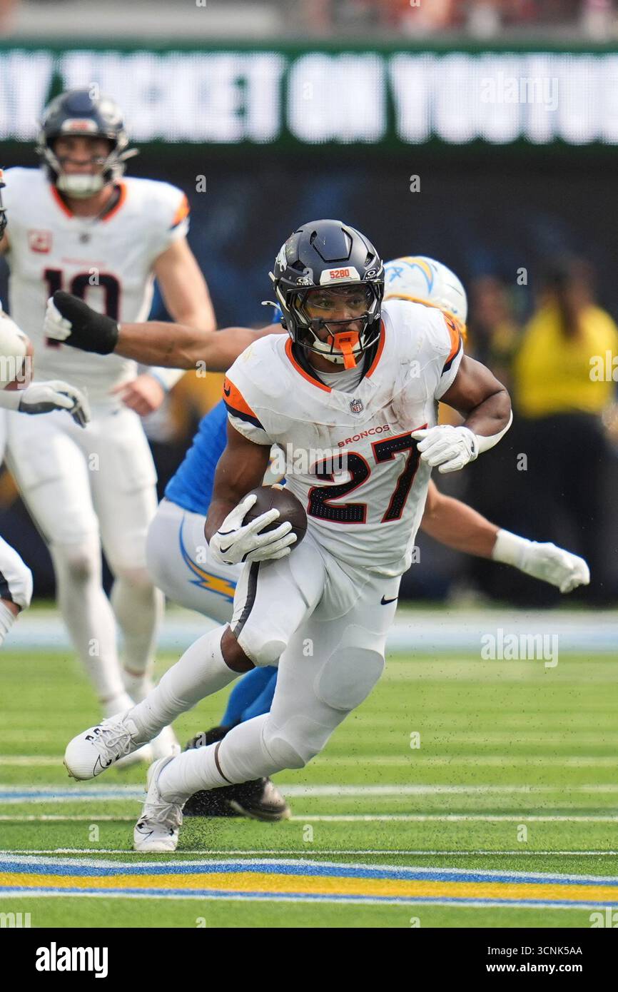 Denver Broncos running back J.K. Dobbins (27) carries during the second ...