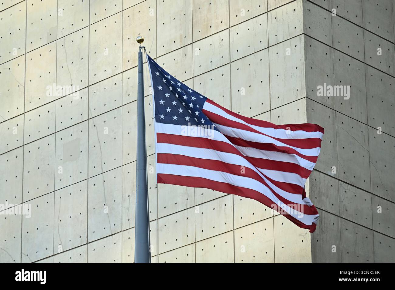 The flag of the United States of America (USA) flys at a building near ...
