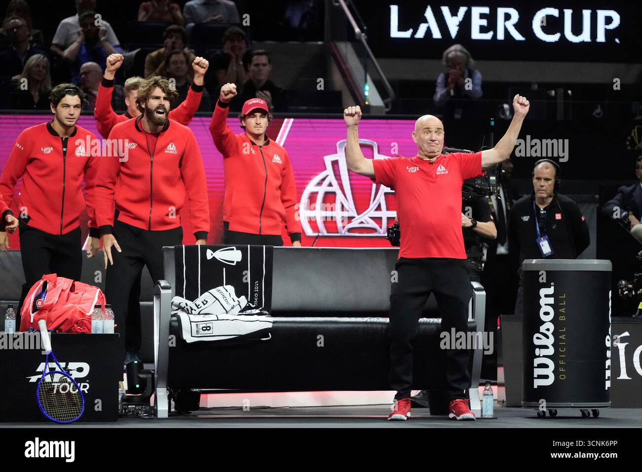Team World captain Andre Agassi, right, celebrates in front of players ...