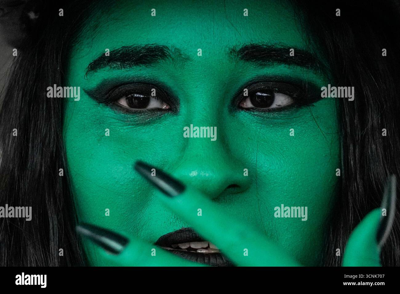 A cosplayer dressed as a witch attends a Comic-Con convention in Panama ...