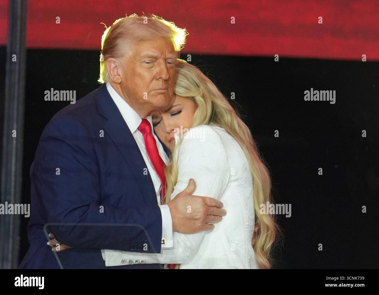 President Donald Trump embraces Erika Kirk at a memorial for Charlie ...