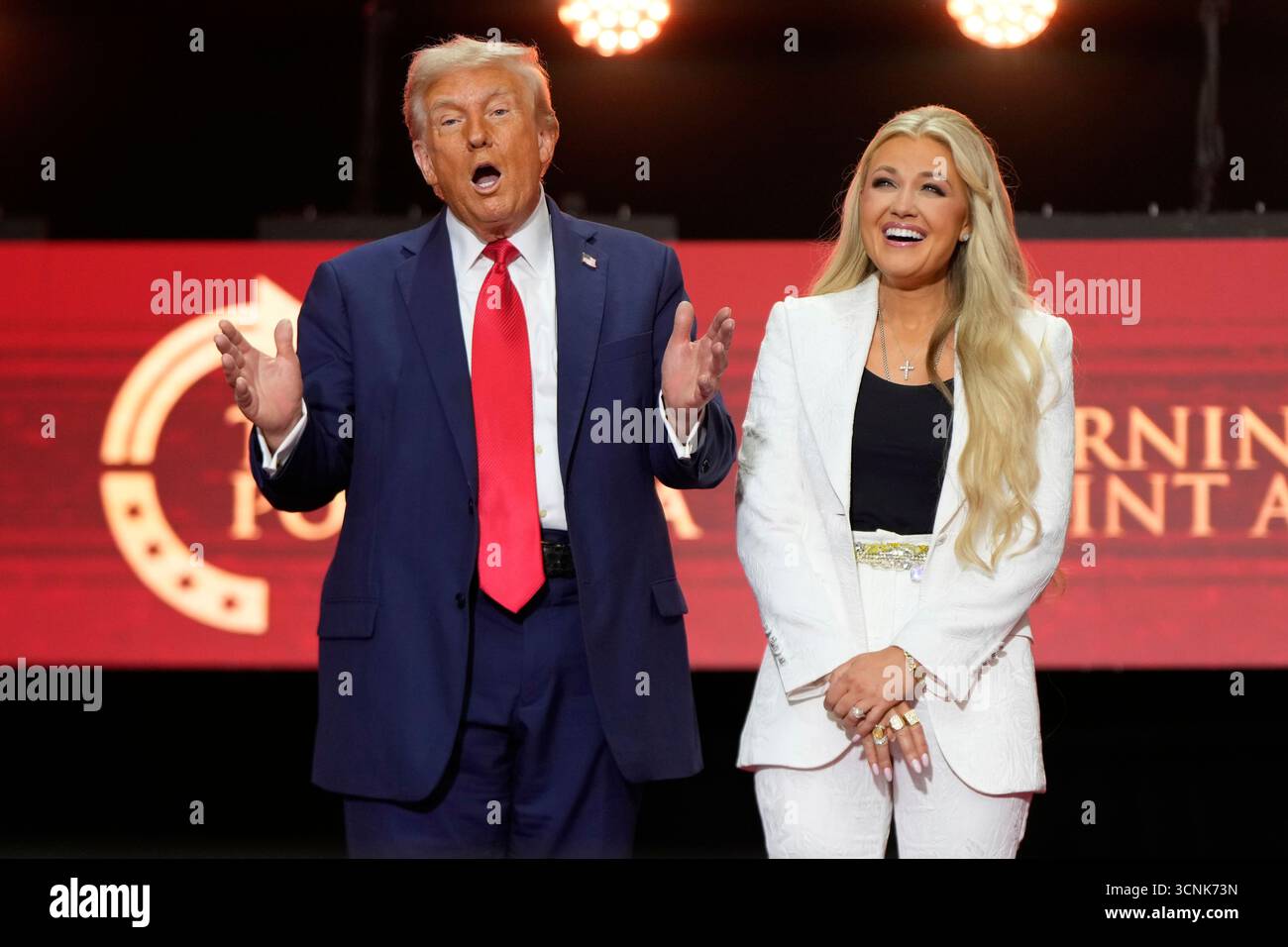 President Donald Trump, left, stands with Erika Kirk at the memorial of ...