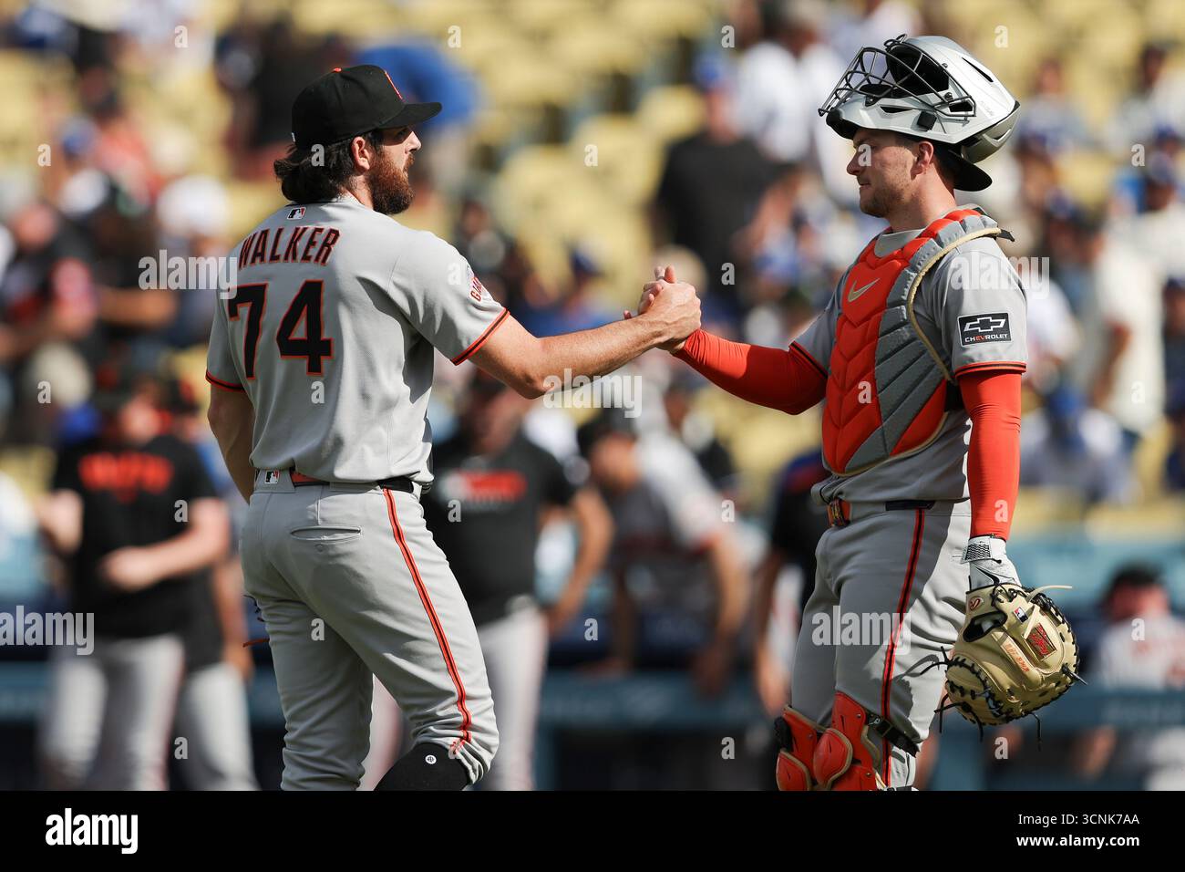 San Francisco Giants pitcher Ryan Walker (74) and catcher Patrick Bailey, right, celebrate after ...