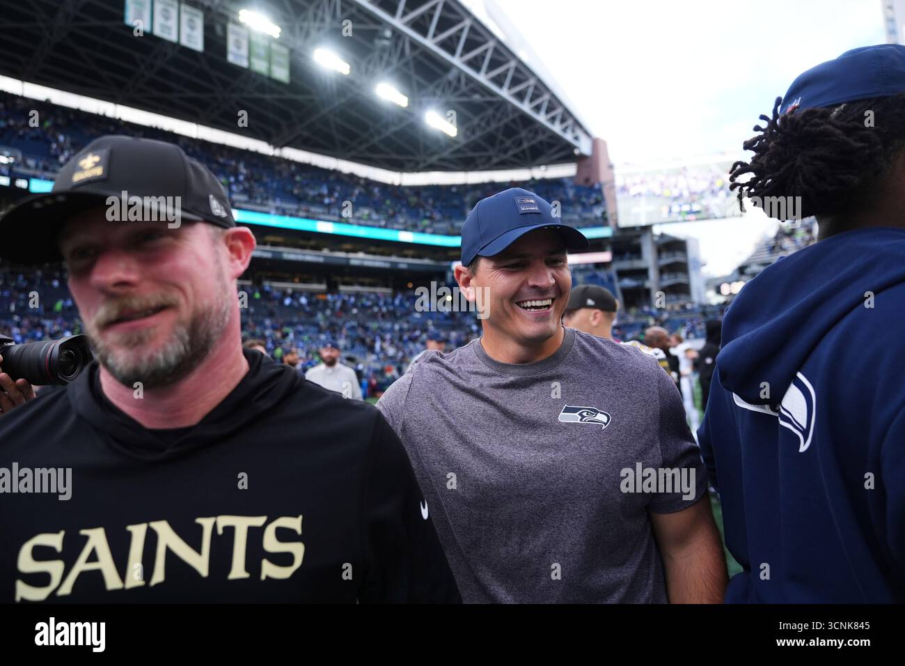 Seattle Seahawks head coach Mike Macdonald walks on the field after an ...
