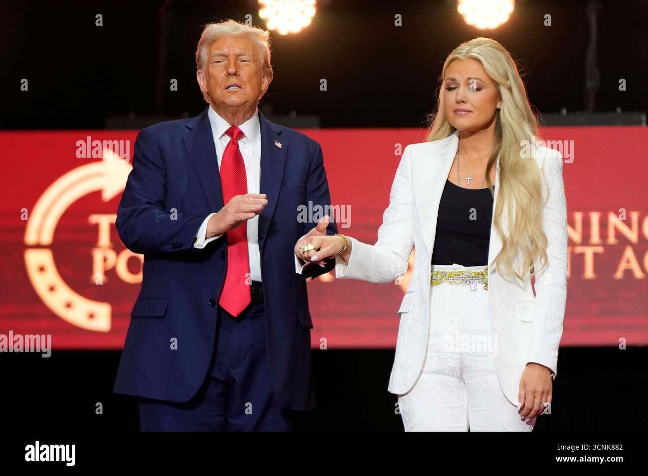 President Donald Trump, left, stands with Erika Kurk at the conclusion ...