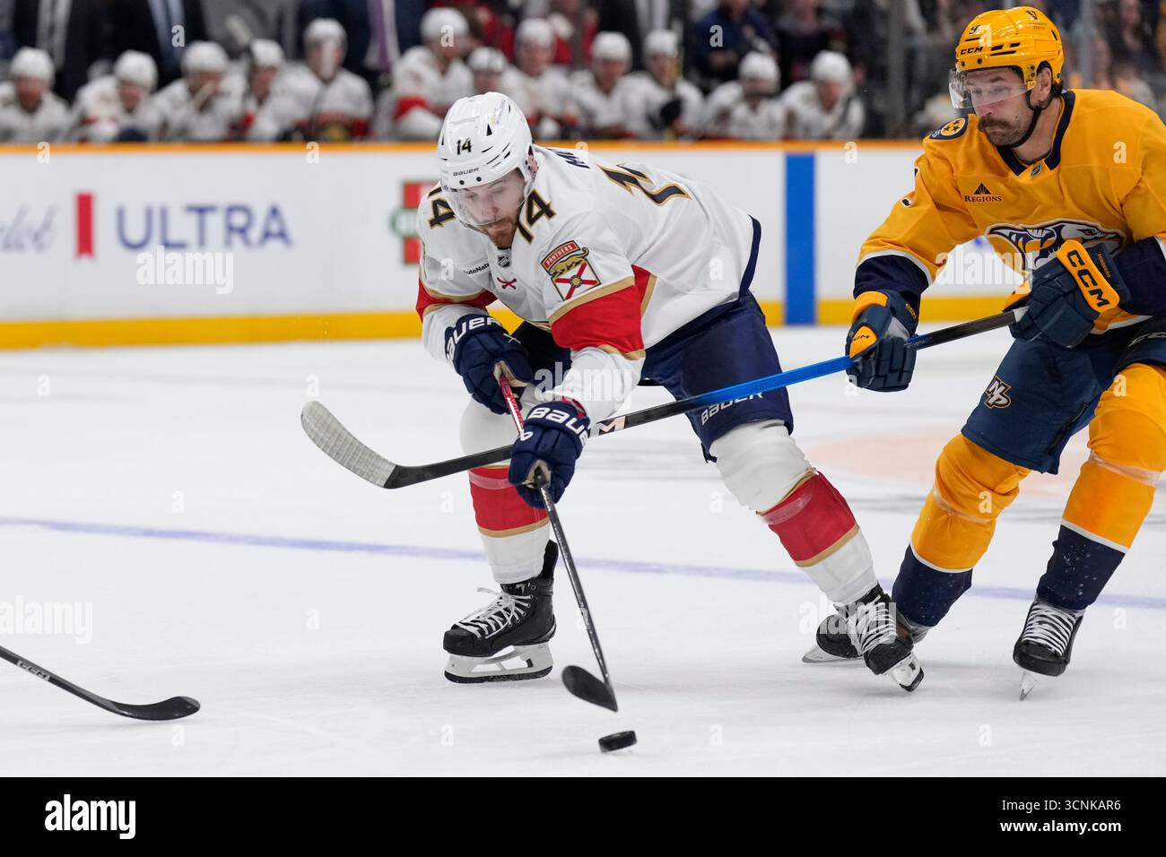 Florida Panthers forward Tyler Motte (14) skates the puck past ...