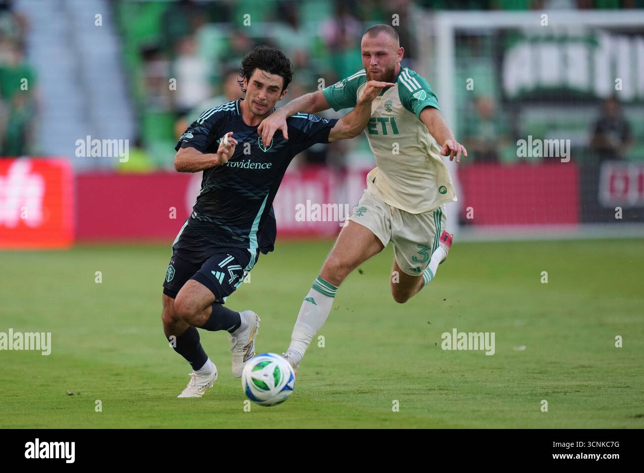 Seattle Sounders'Paul Rothrock (14) and Austin FC defender Danilo Boza ...
