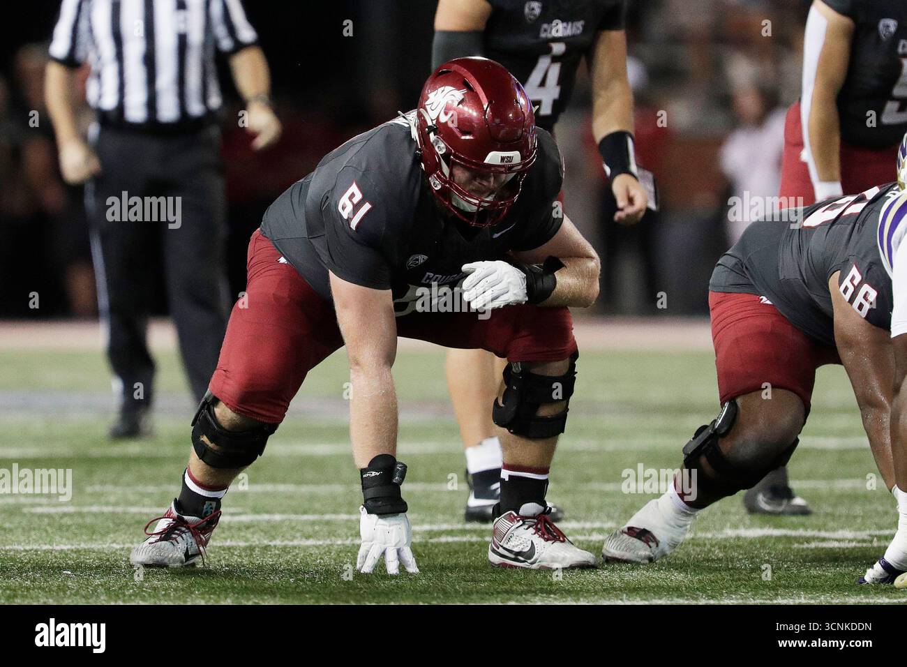 Washington State offensive lineman Christian Hilborn (61) lines up for ...