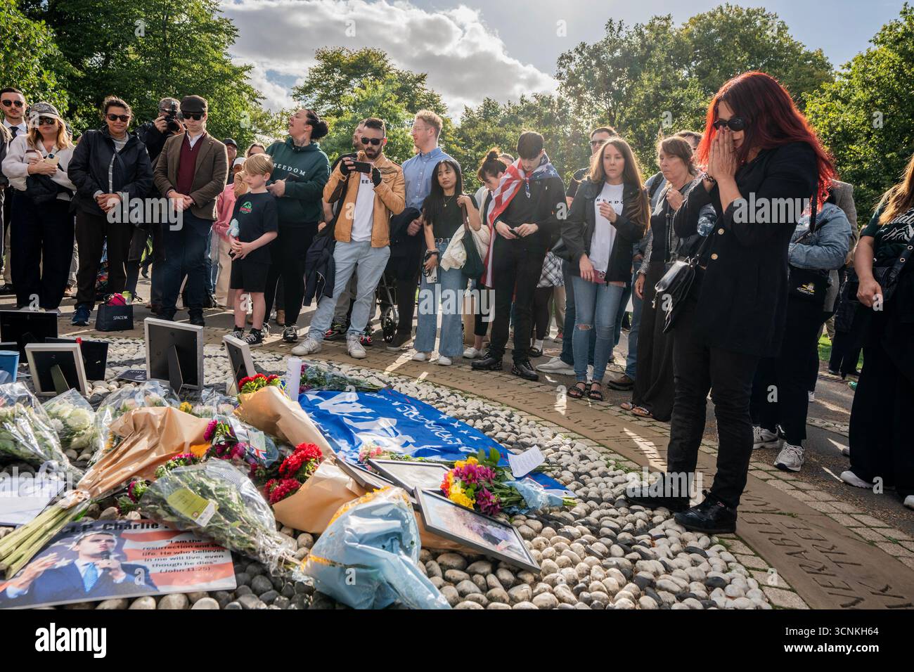 A mourner says a silent prayer to the recently-murdered Charlie Kirk in ...