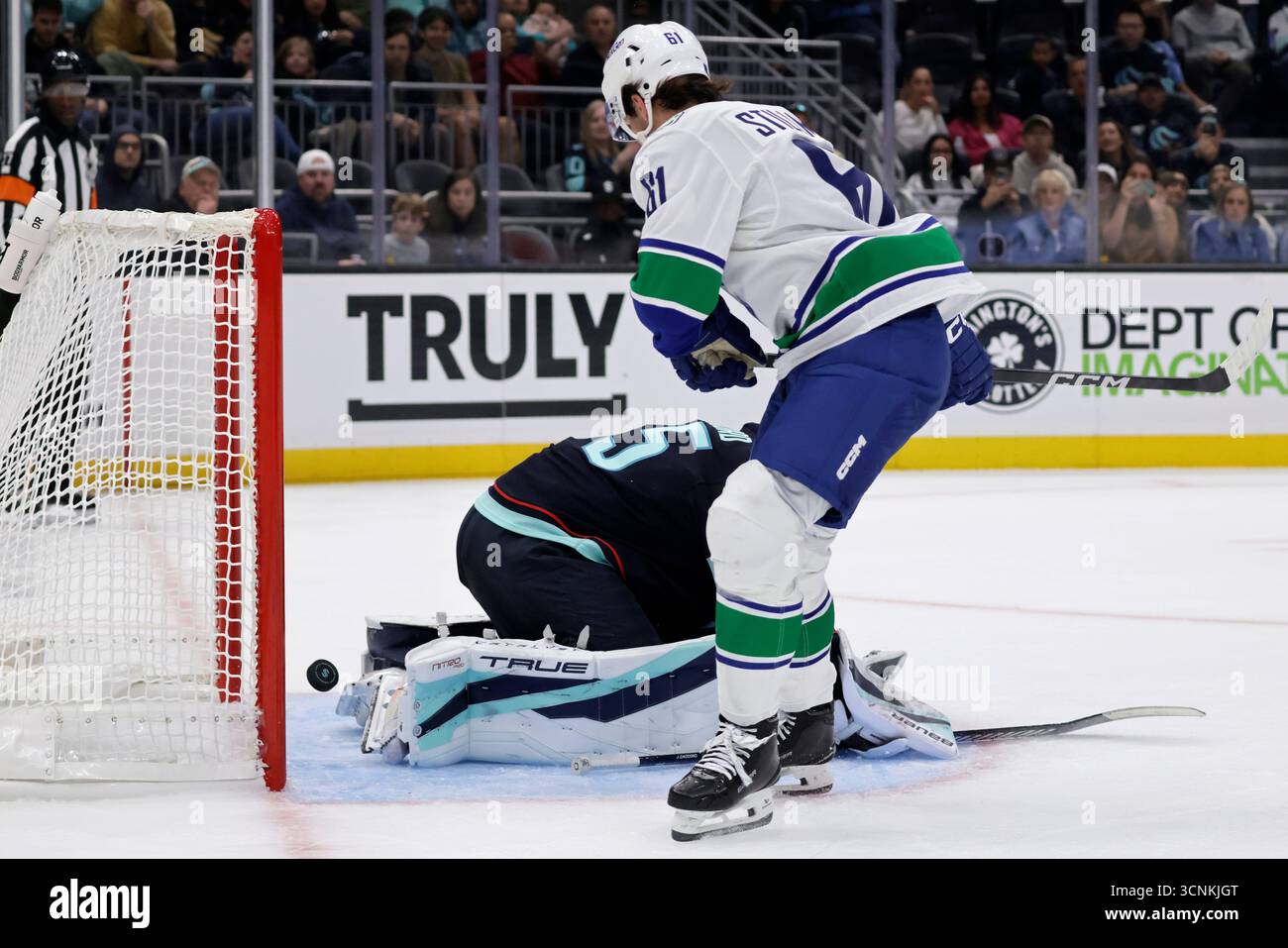 Vancouver Canucks right wing Chase Stillman (61) scores against Seattle ...