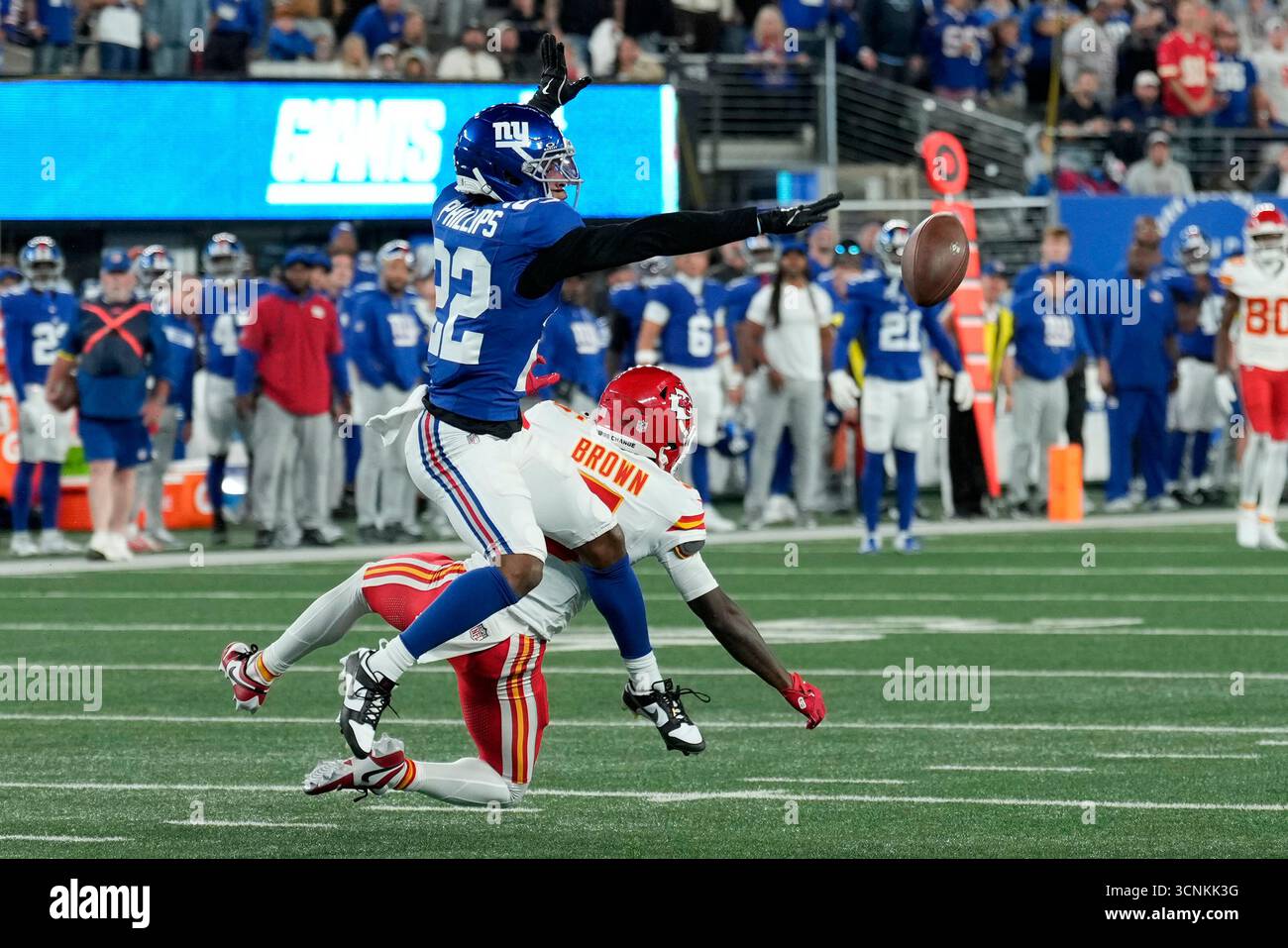 New York Giants cornerback Dru Phillips (22) reaches for the ball ...