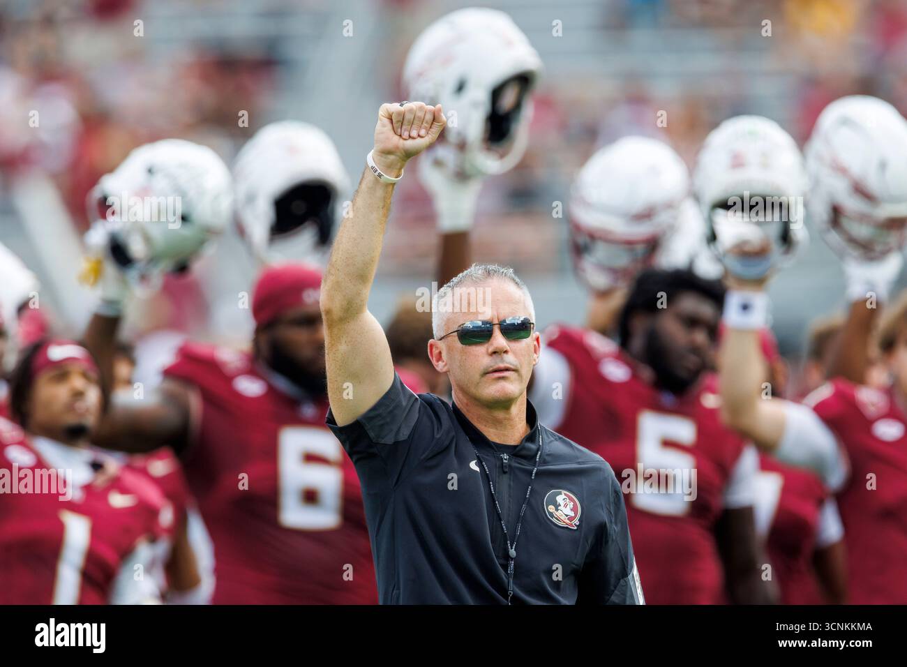Florida State head coach Mike Norvell leads his team off the field ...