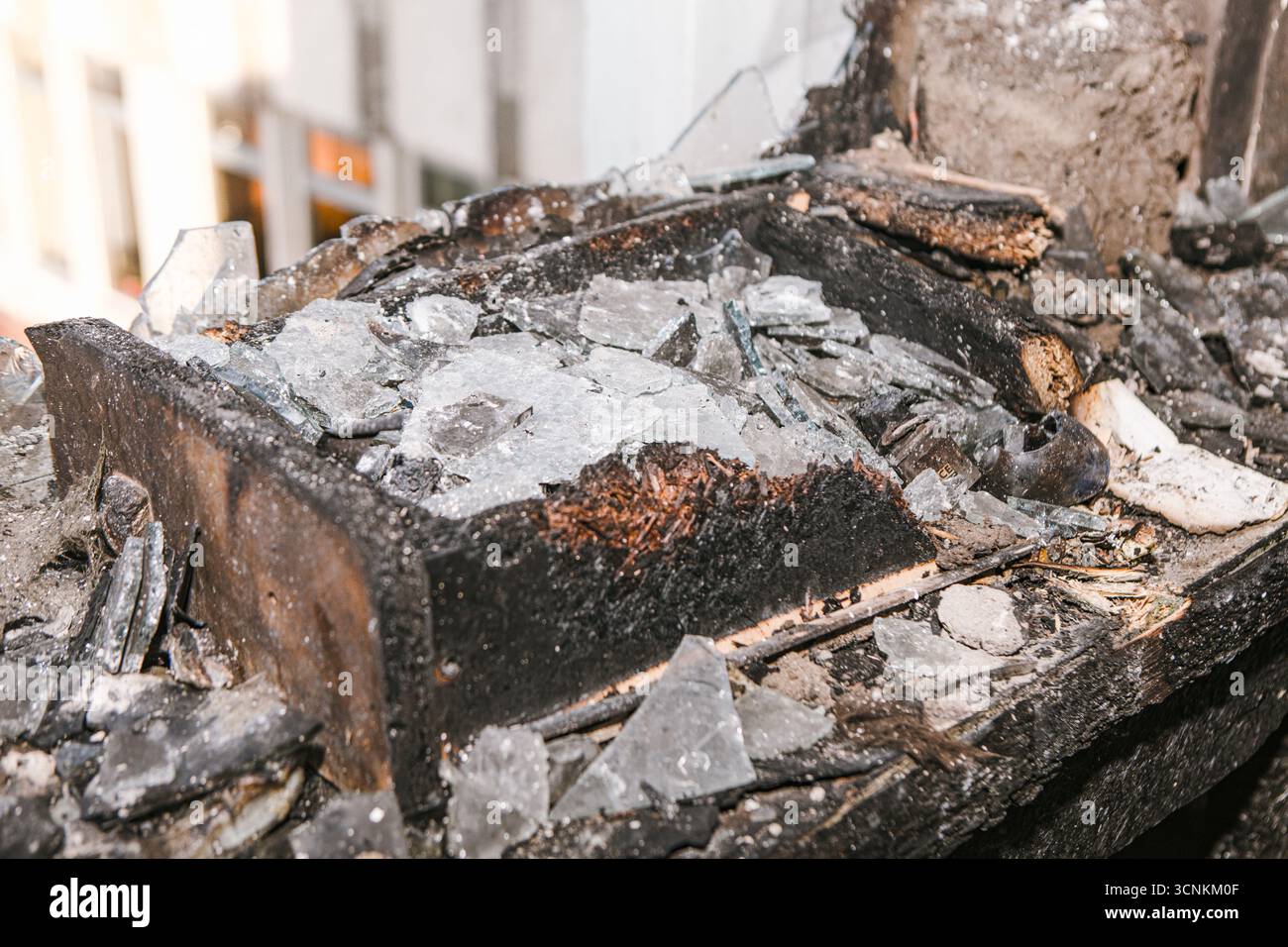 Aftermath of devastating fire, showcasing charred debris and broken ...