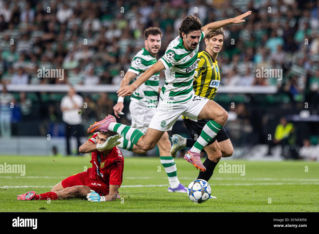 Francisco Trincao of Sporting CP with Sherkhan Kalmurza of FC Kairat ...