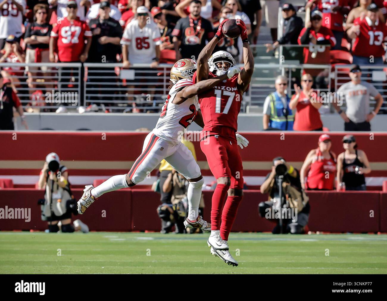 San Francisco 49ers' Upton Stout, left, breaks up a pass to Arizona ...