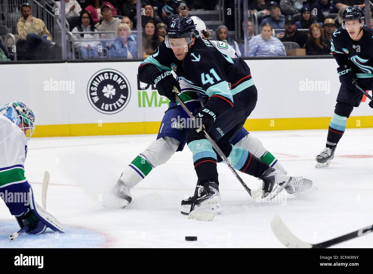 Seattle Kraken defenseman Ryker Evans (41) passes the puck with ...