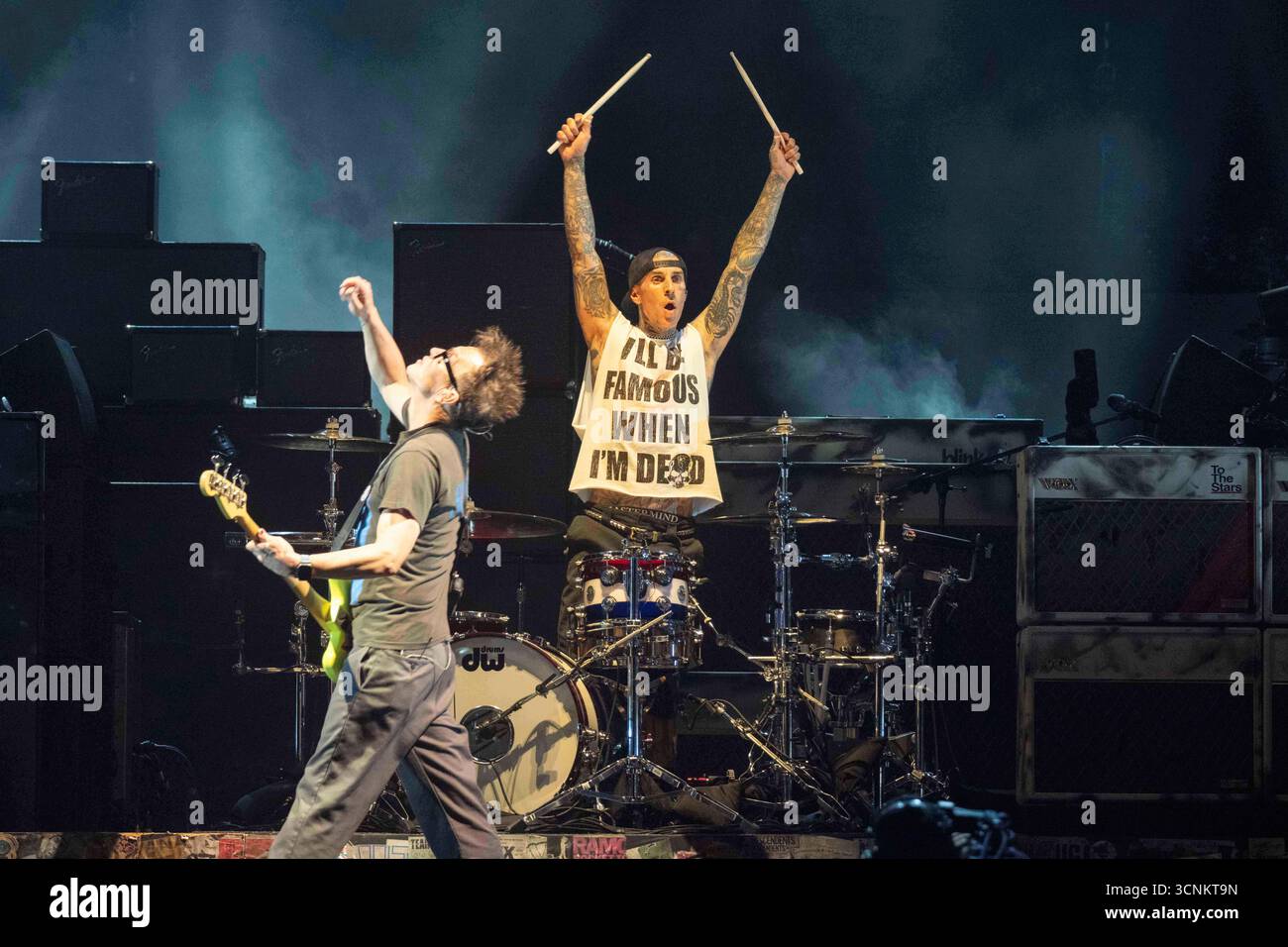 Mark Hoppus, left, and Travis Barker, of Blink 182 perform during the ...