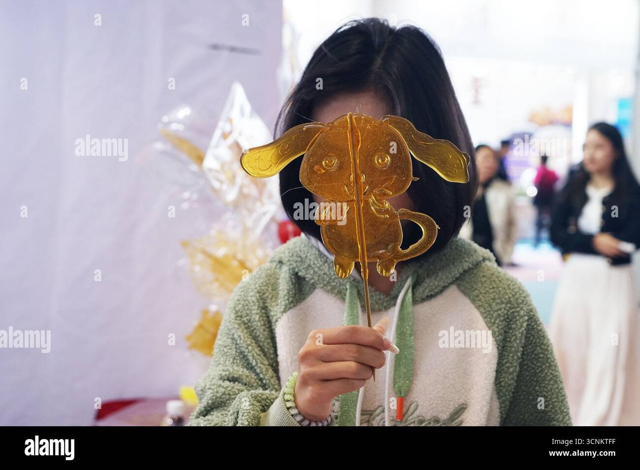 XI'AN, CHINA - SEPTEMBER 20, 2025 - A citizen bought a sugar painting ...