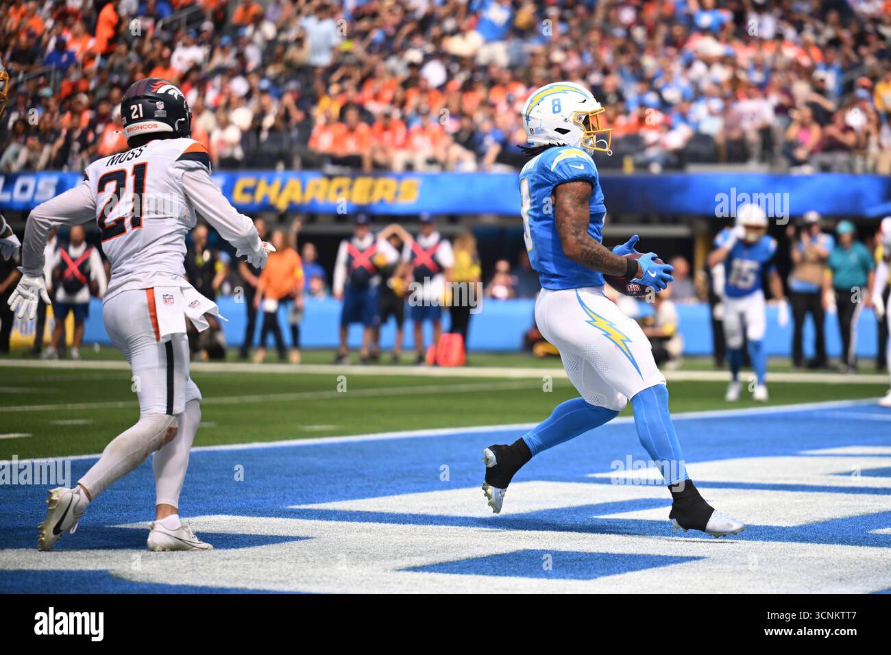 Los Angeles Chargers running back Omarion Hampton (8) scores a rushing ...