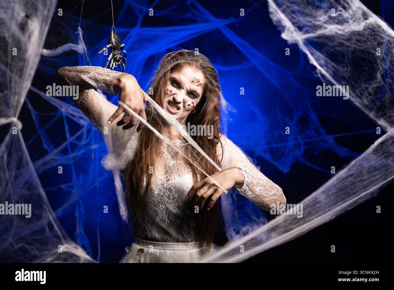 Scary ghost woman with blood and angry face with clawing hands crawling ...