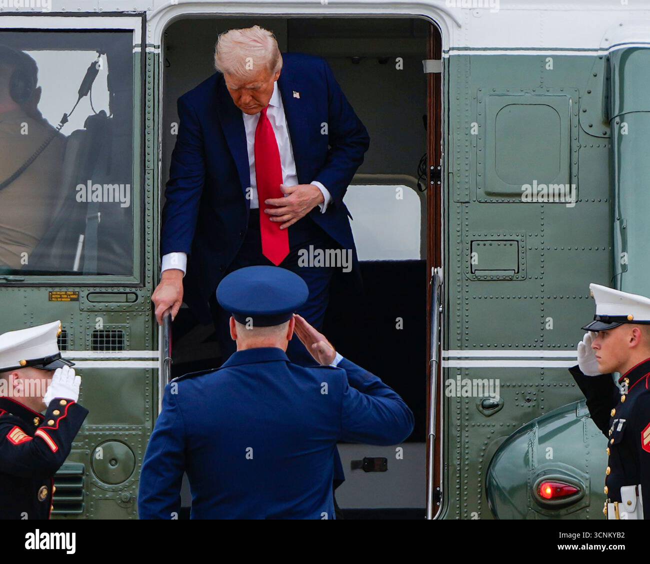 President Donald Trump disembarks Marine One, Sunday, Sept. 21, 2025 ...