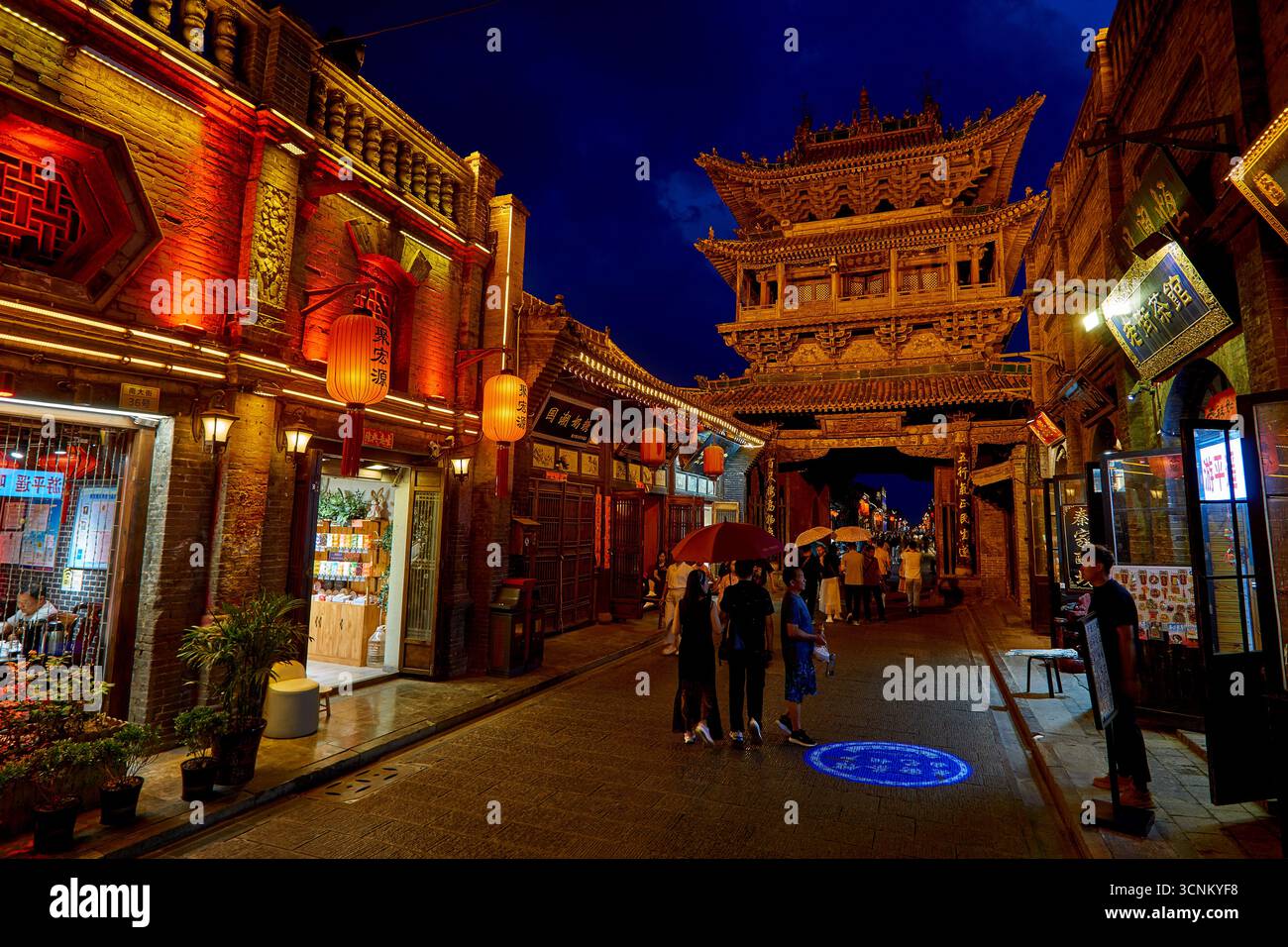 Pingyao Ancient City by night - the old Market Tower in the main ...