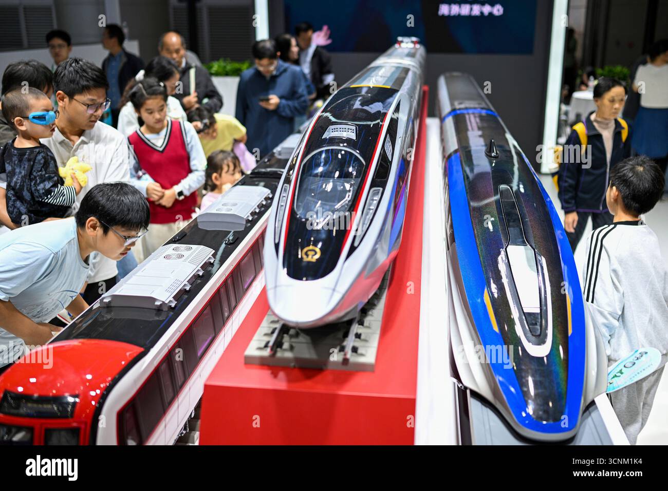 Visitors check out the model of bullet trains developed by CRRC during ...