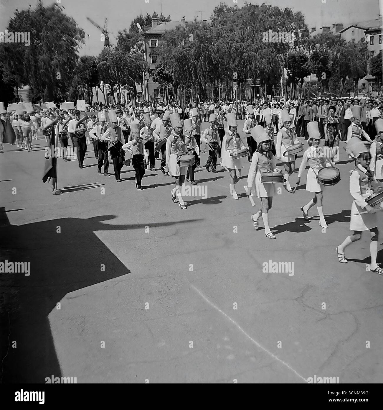 An archival black-and-white photograph shows a large-scale festive ...